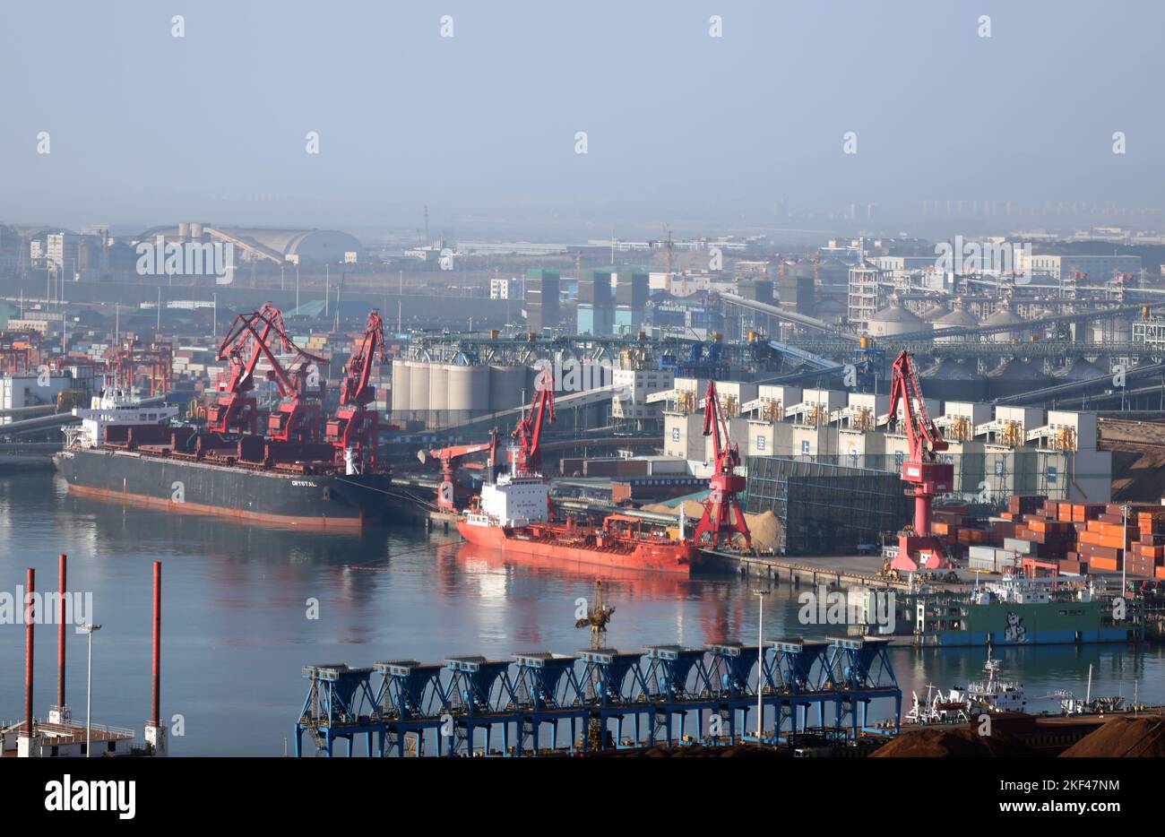 The busy working scene in the iron ore yard near the port, Rizhao City ...