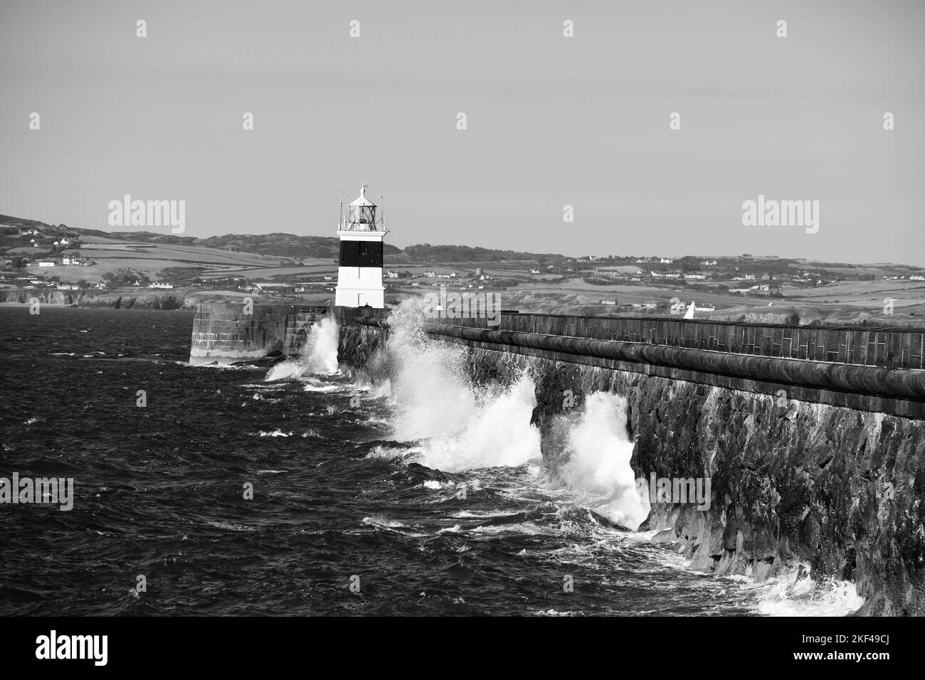Waves crashing into harbour wall Black and White Stock Photos & Images ...
