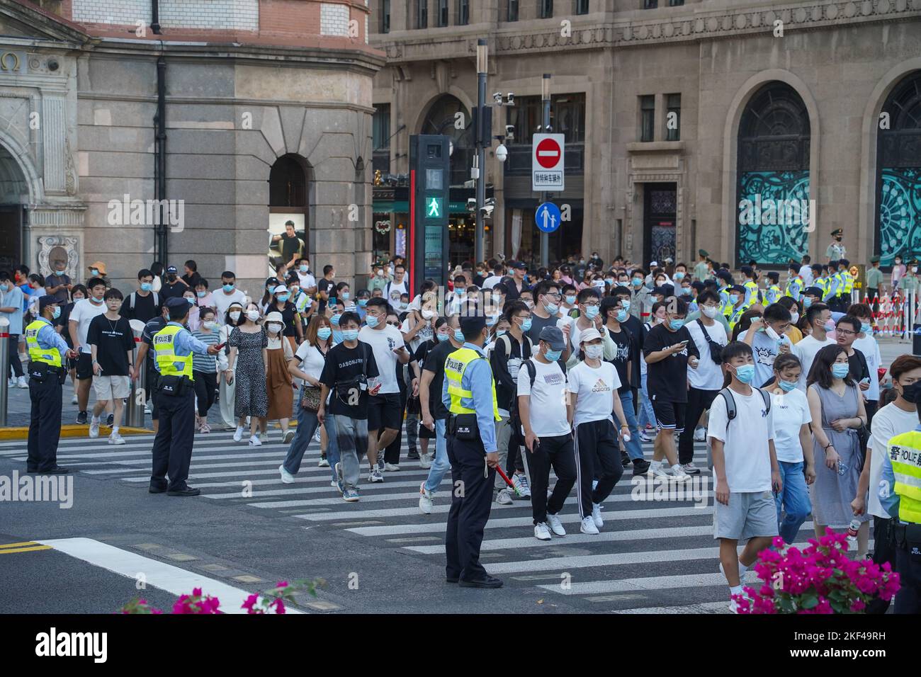 Traffic policemen built up a "zippered human wall" to disperse the ...