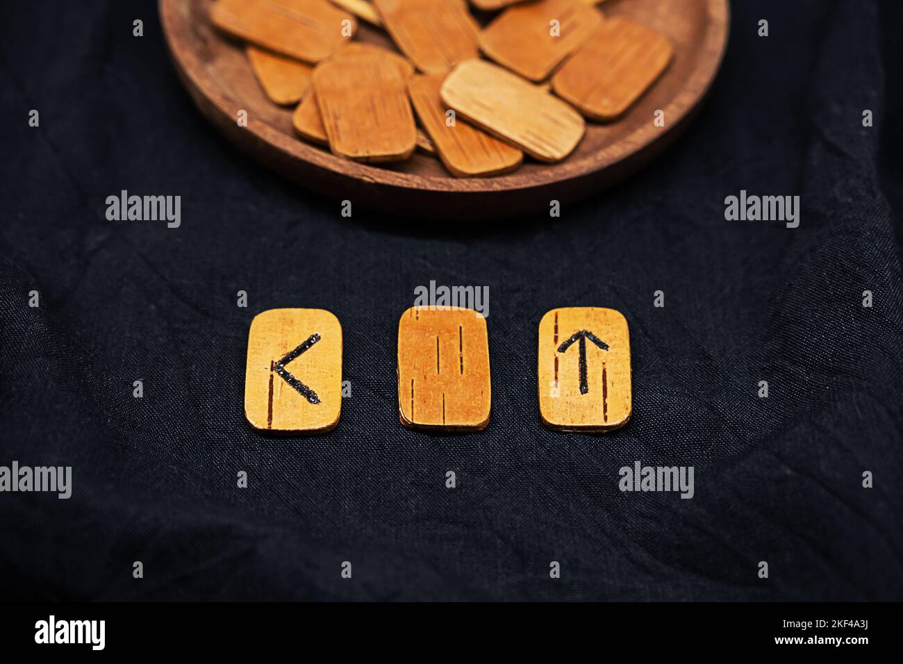 Handmade wooden runes on black fabric. Heap of Scandinavian runes for ...