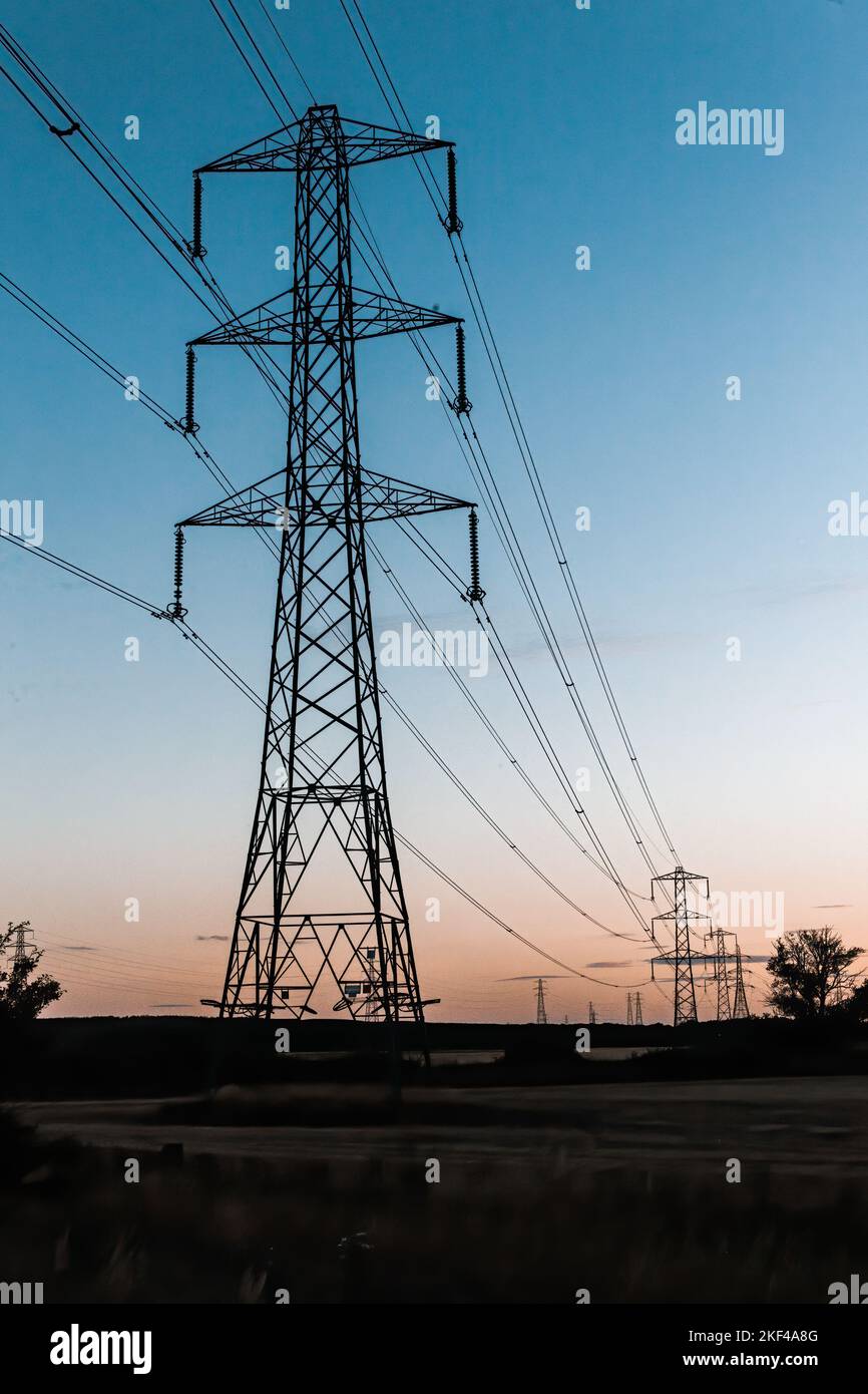 Summer Sunset with Leading Line of Electricity Power Lines and Masts ...