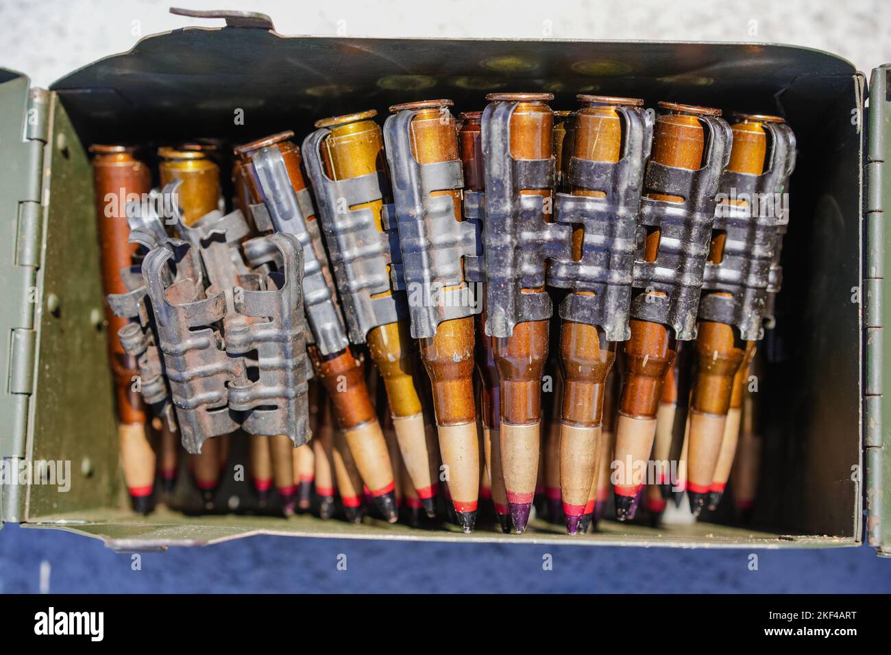 Close up shot of a machine gun belt loaded with cartridges, in an ammo ...