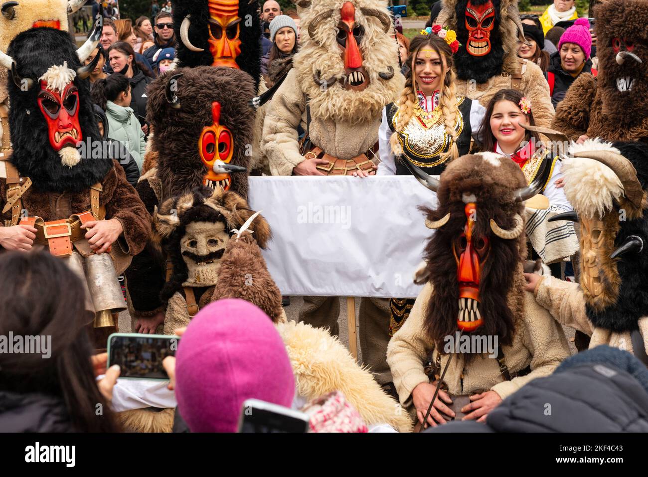 Kukeri dancers with intricate costumes, large bells and masks dancing ...