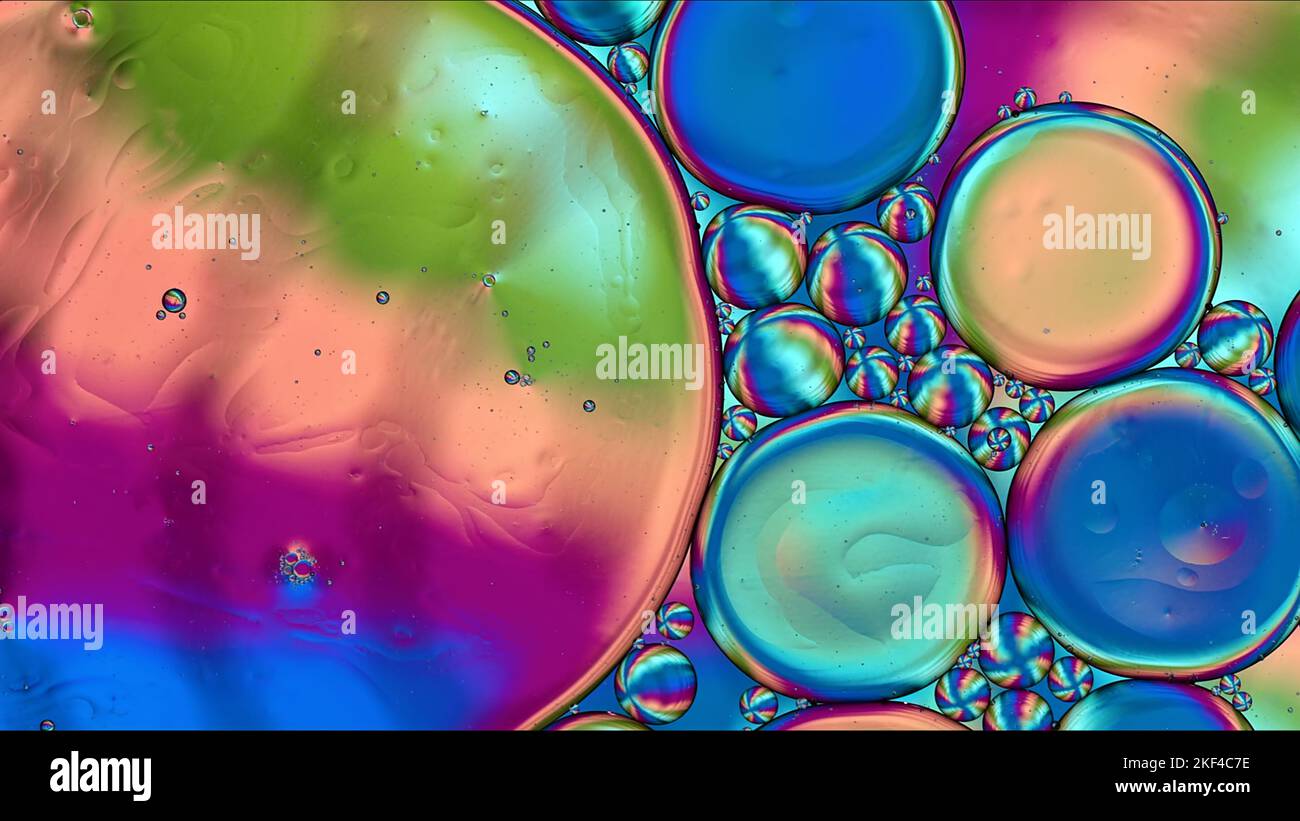 Abstract Colorful Food Oil Drops Bubbles and spheres Flowing on Water ...