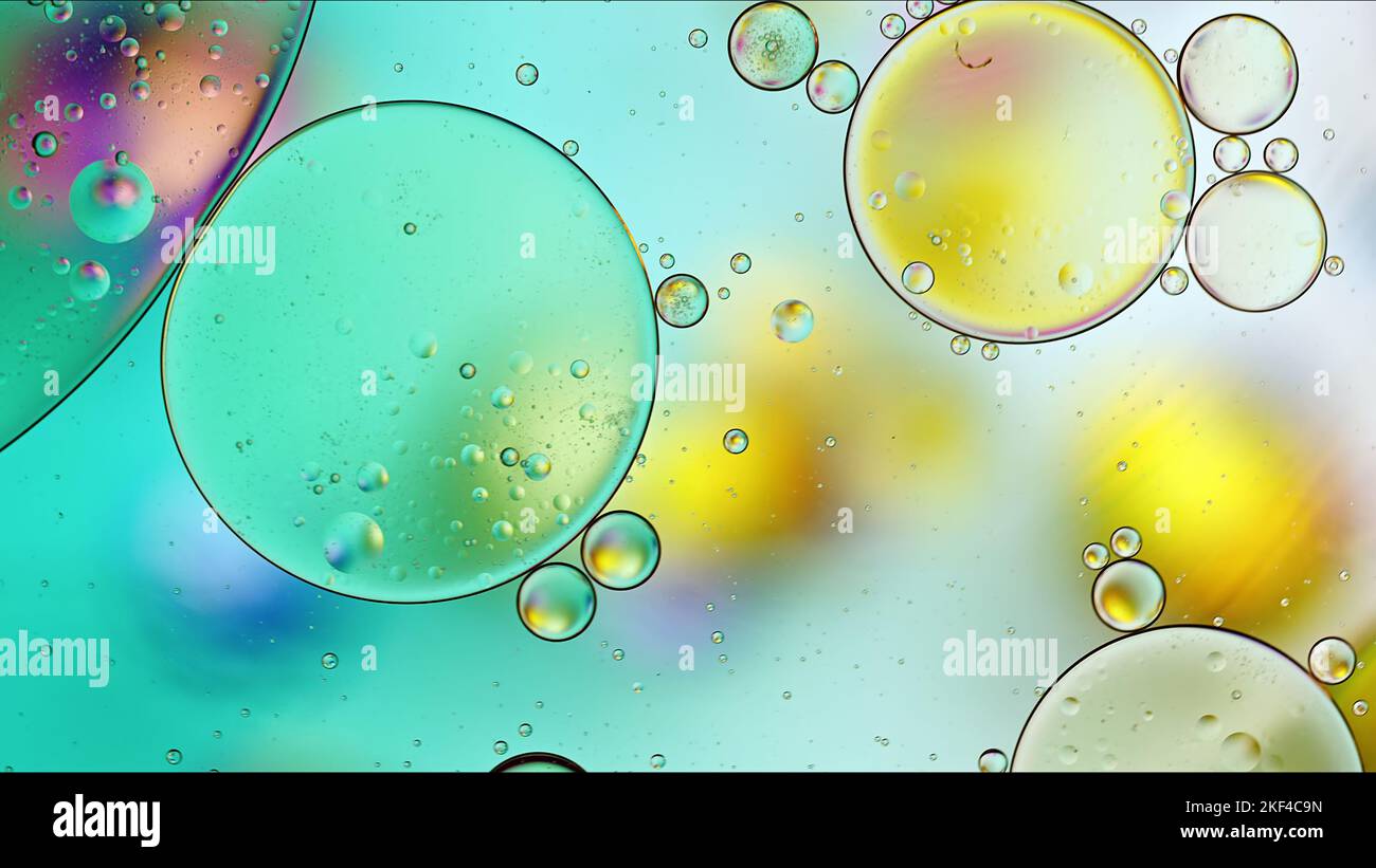 Abstract Colorful Food Oil Drops Bubbles and spheres Flowing on Water ...