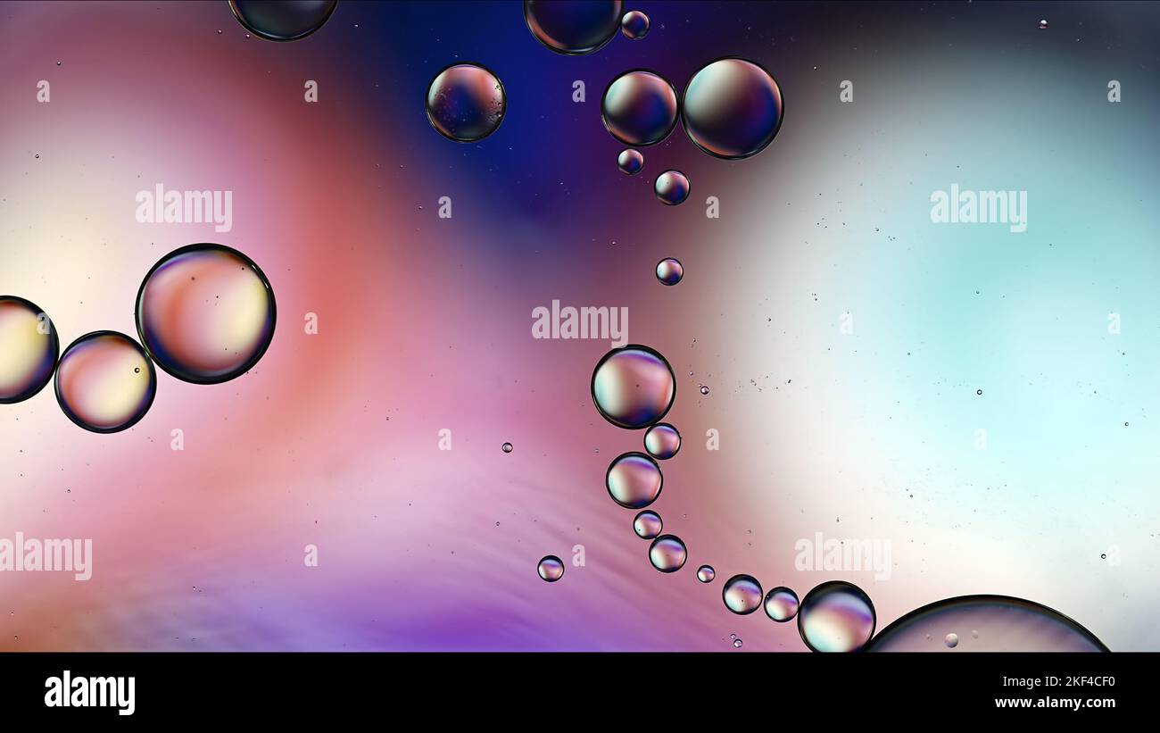 Abstract Colorful Food Oil Drops Bubbles and spheres Flowing on Water ...