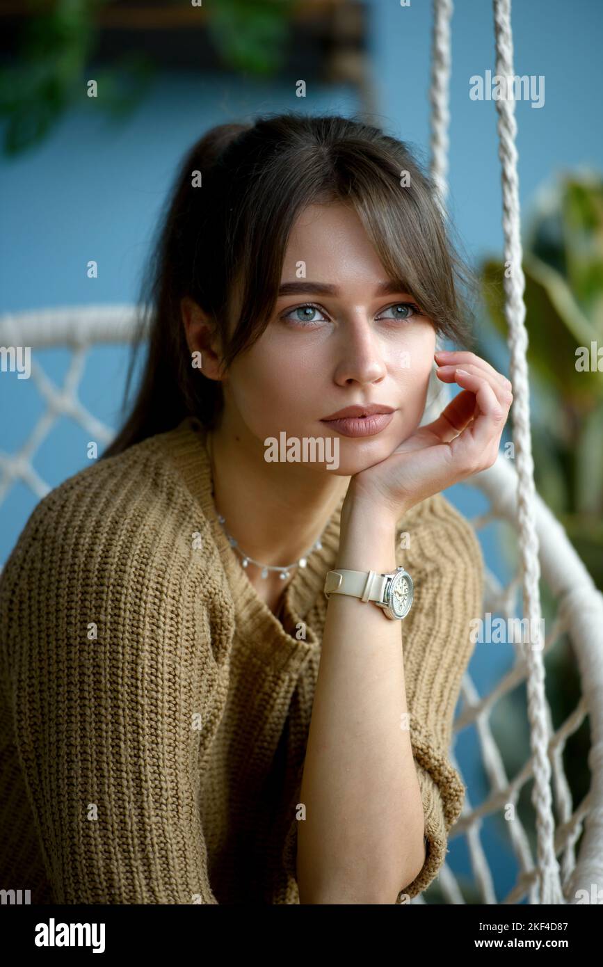 Beautiful young brunette woman portrait. indoor shot Stock Photo - Alamy