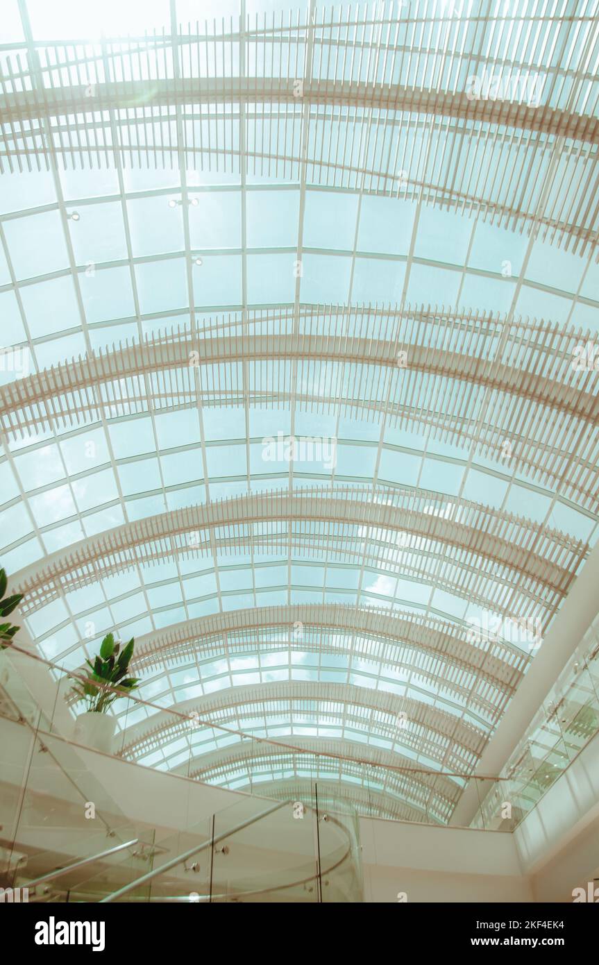 A vertical of a curved metal glass construction of a public roof Stock ...