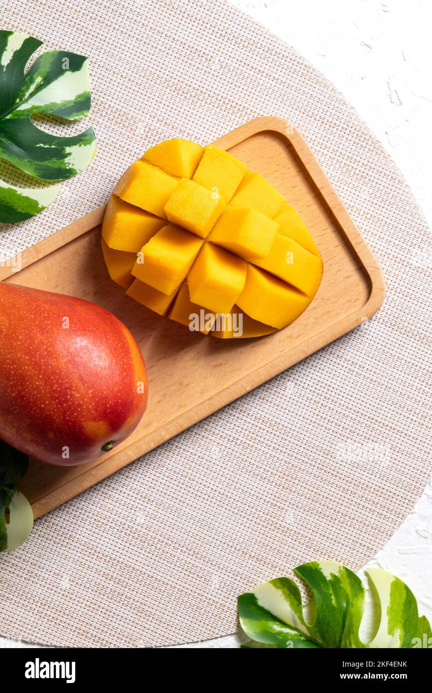 Mango background design concept. Top view of diced fresh mango fruit ...