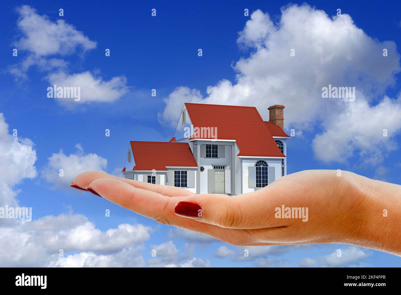 Hand mit Einfamilienhaus, Cumulus Wolken, blauer Himmel, Frühling in ...