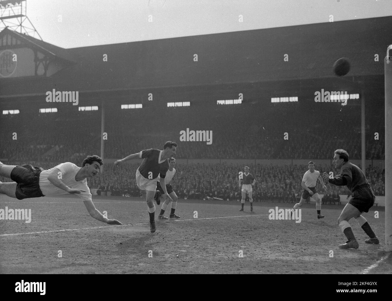 Luton Town's Allan Brown heads over Tottenham Hotspur goalkeeper John ...