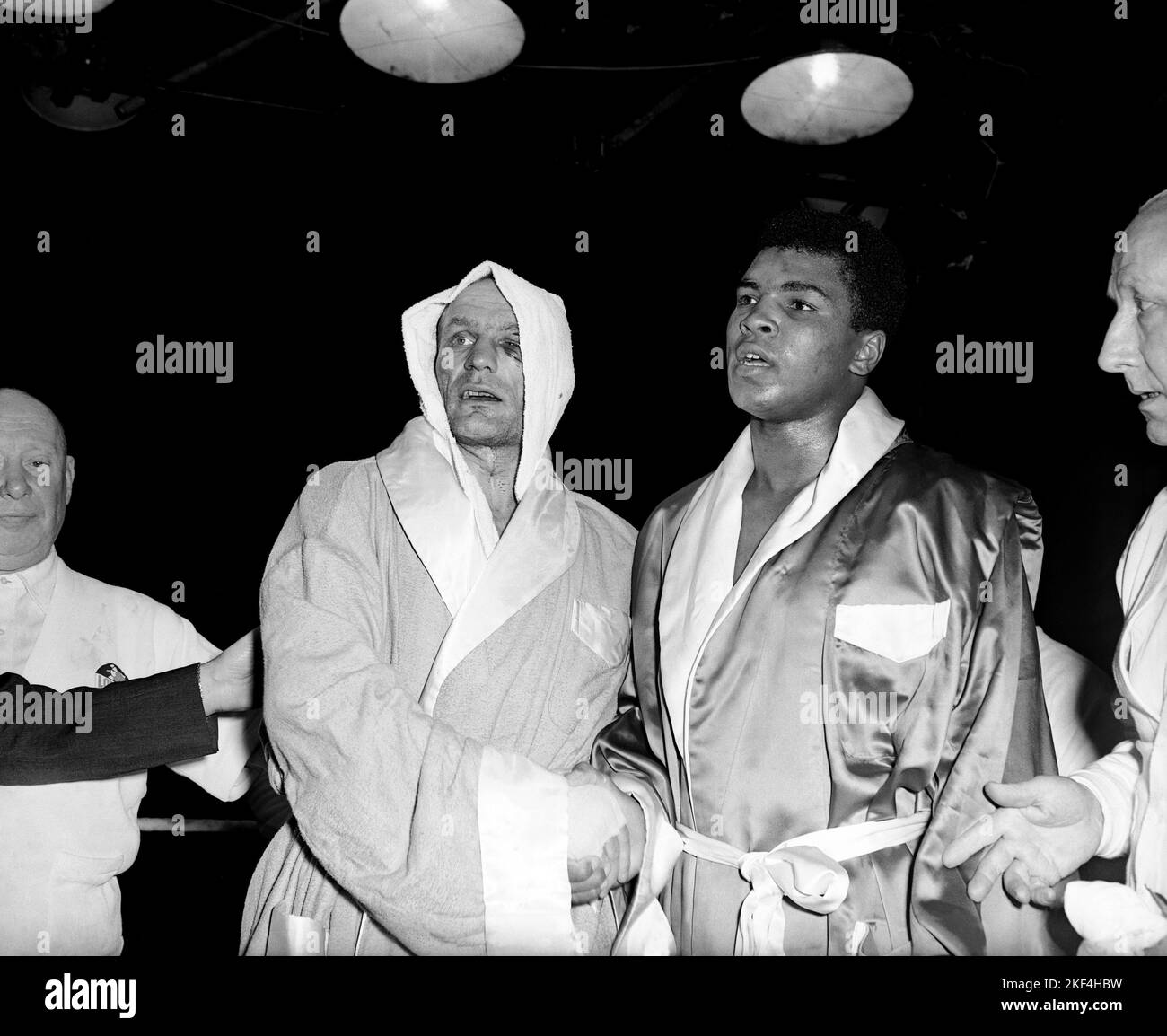 Victorious American heavyweight, Cassius Clay, shakes hands with his ...