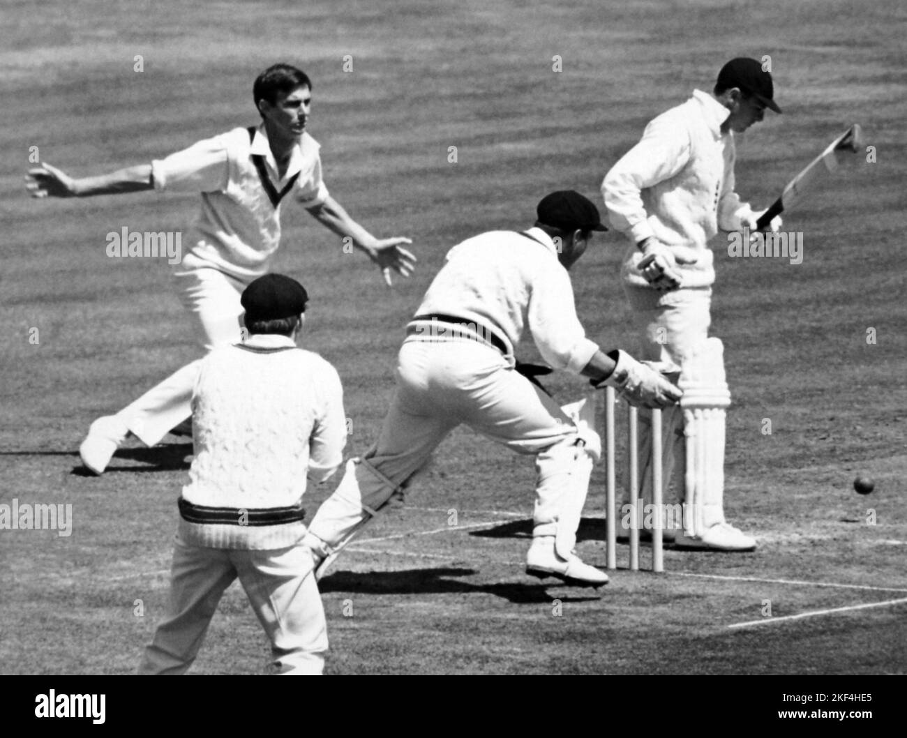 Geoff Boycott (England) receives a ball from Bob Cowper which jumps up ...