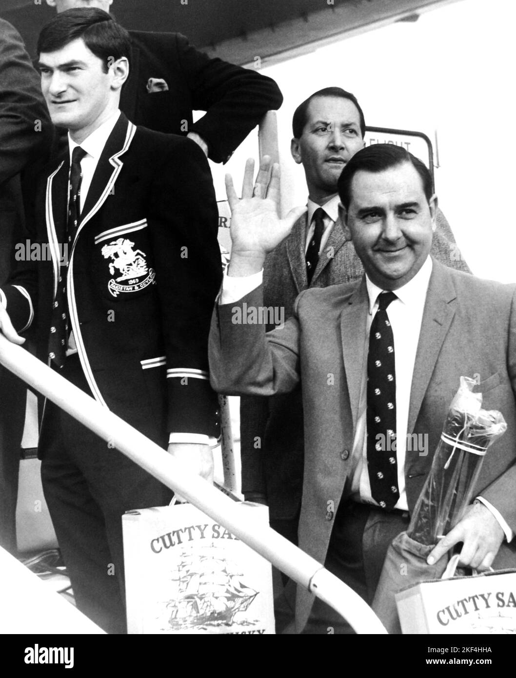 Captain Colin Cowdrey boards the aircraft with Basil D'Oliveira and ...