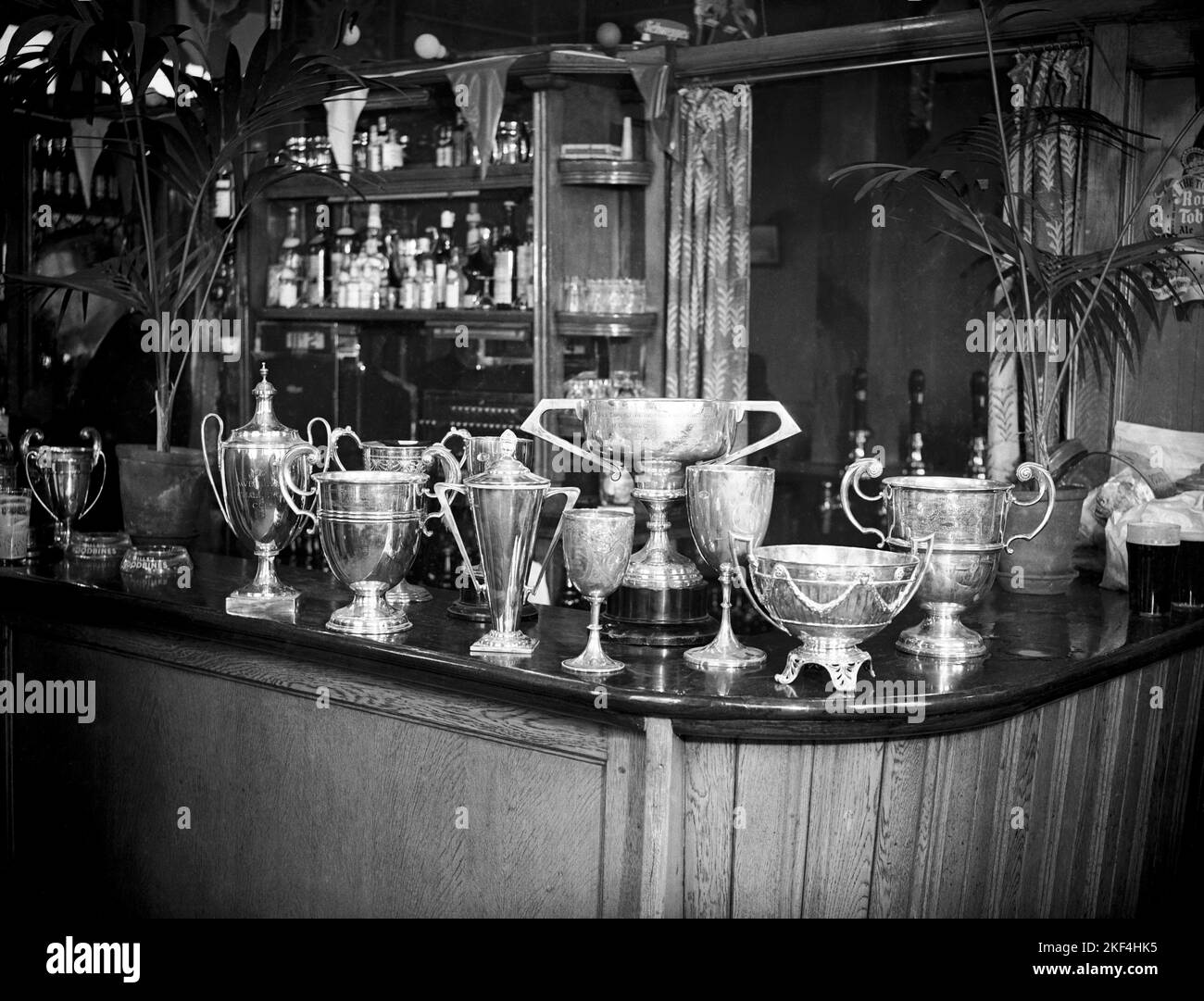 Shot showing various trophies and cups on a bar at a Rowing club Stock ...
