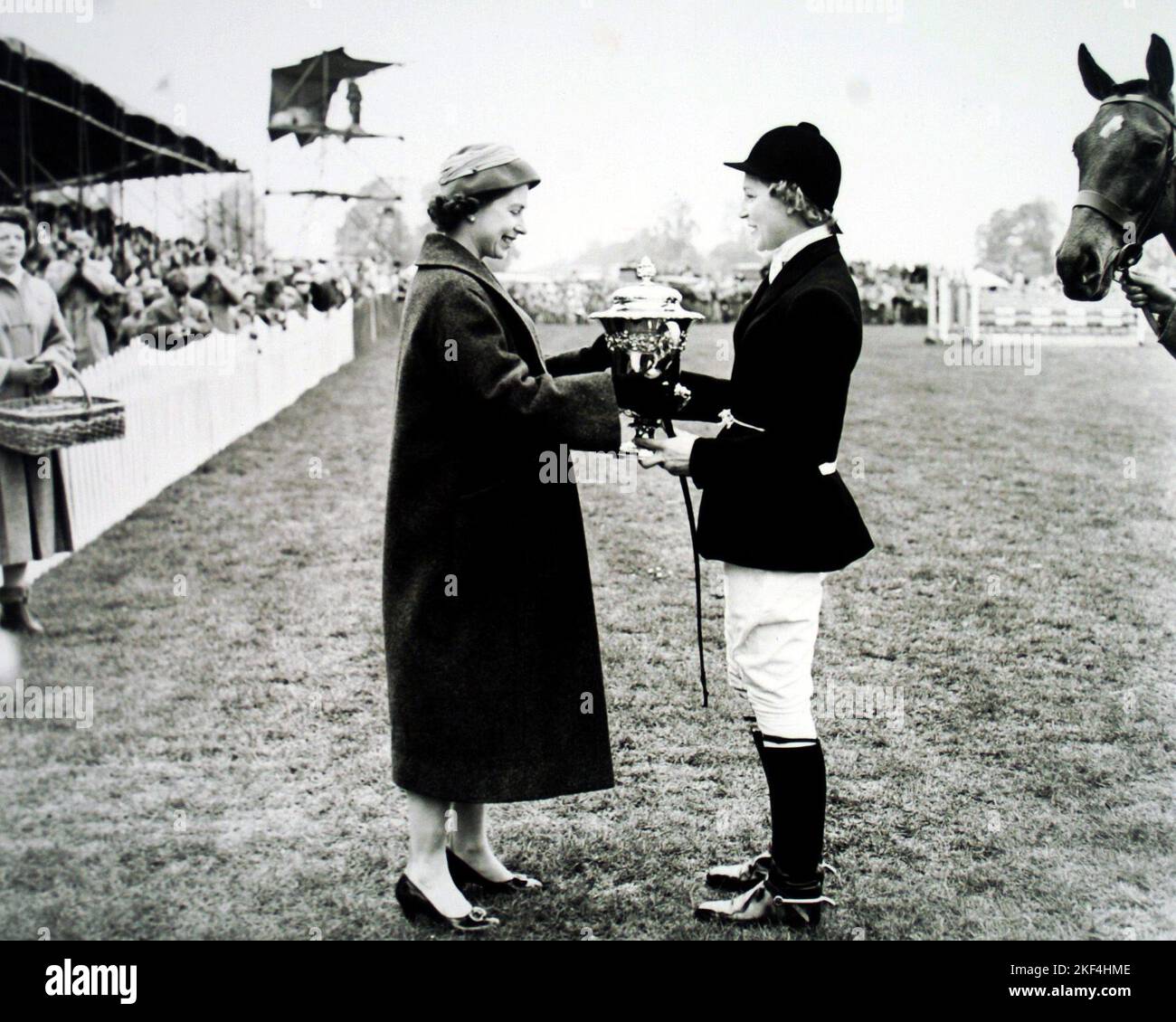 Sheila Willcox receives the trophy from Queen Elizabeth II at the ...