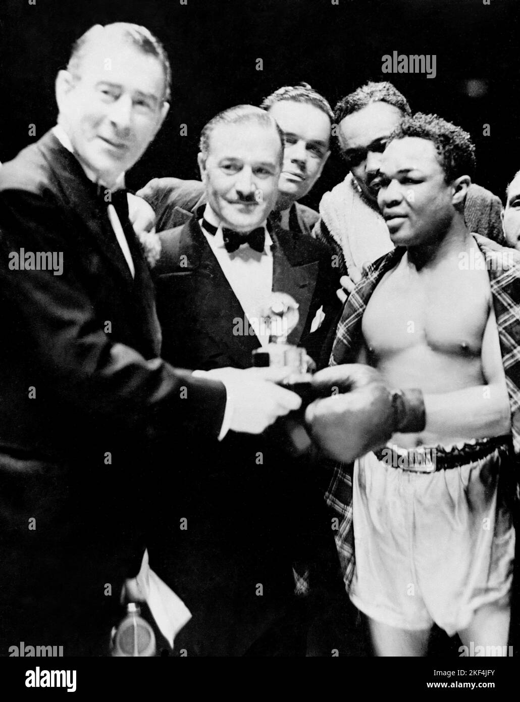 American boxer Henry Armstrong, right, receiving a trophy Stock Photo ...