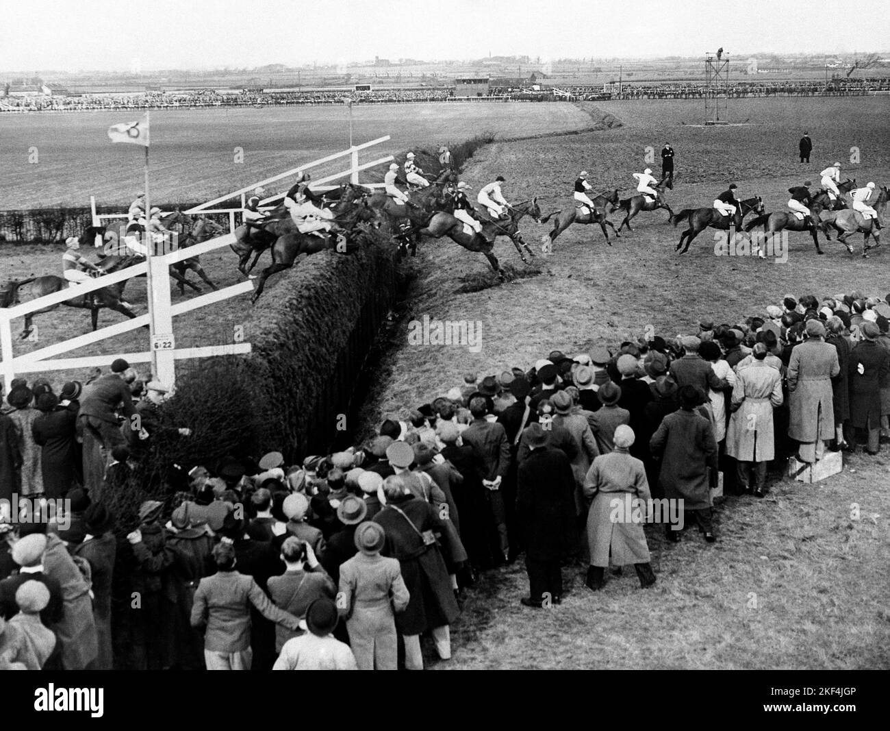 The field jumping Becher's Brook, first time round Stock Photo - Alamy