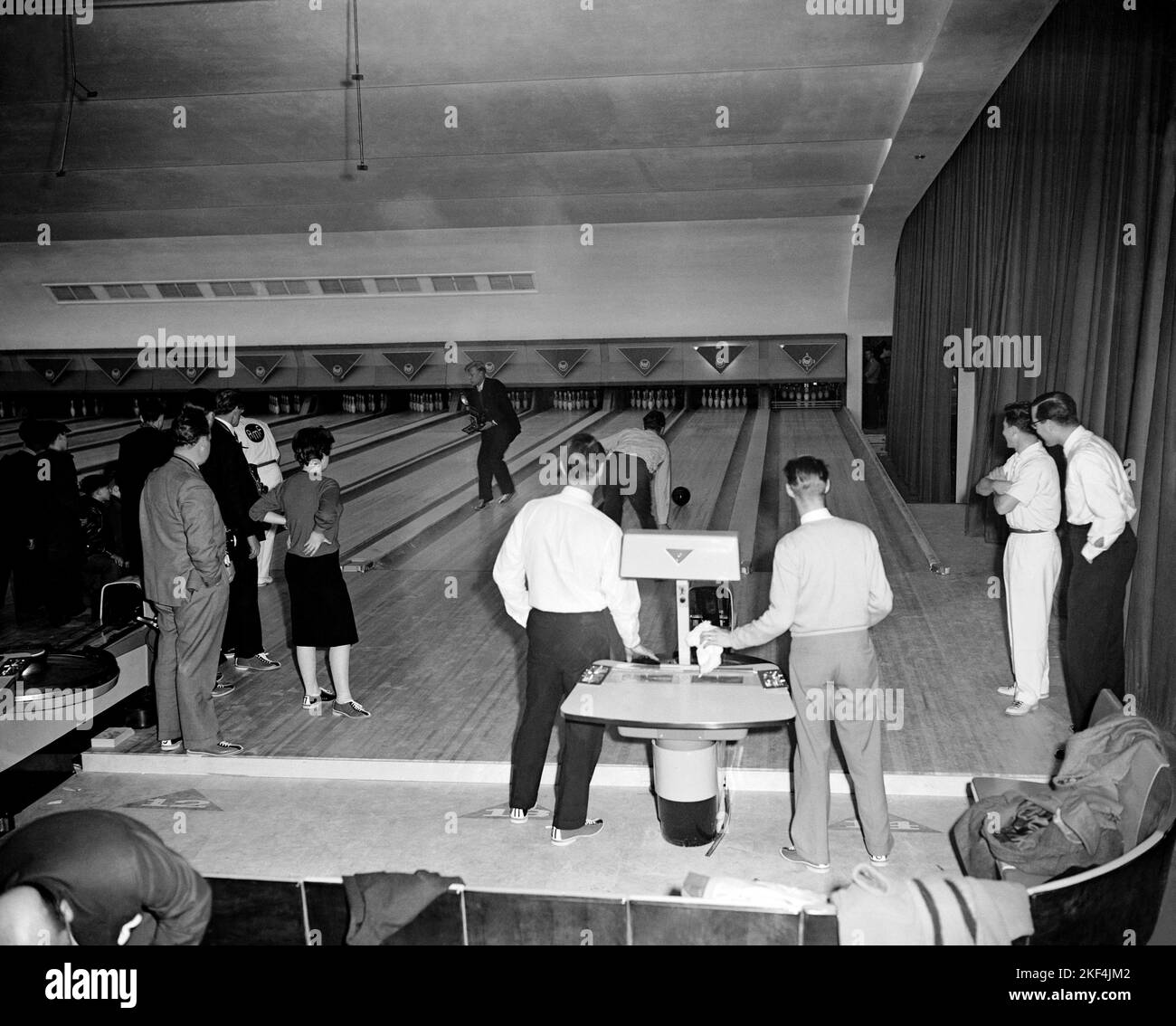 Visitors try their hand at ten pin bowling at the first ten pin bowling ...