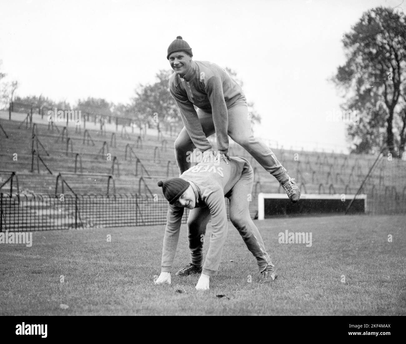 Sweden's Reino Borjesson jumps over team-mate H. Mild during training ...