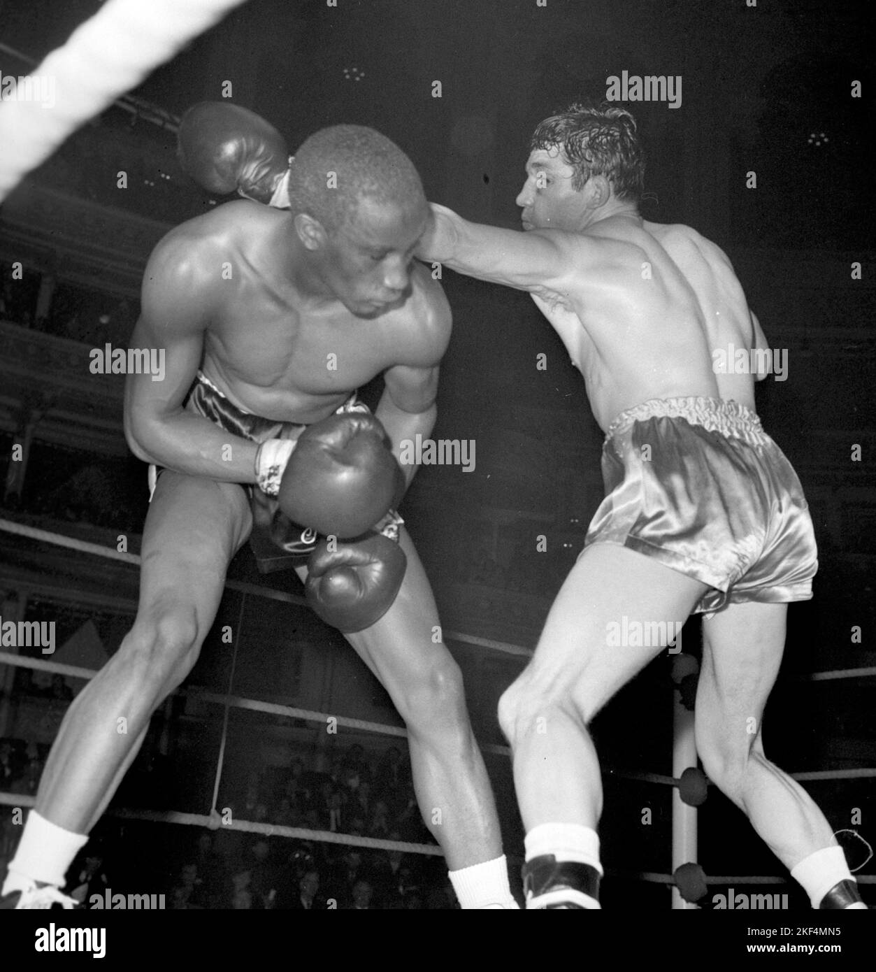 Nottingham's Wally Swift (r) misses with a right as his American ...
