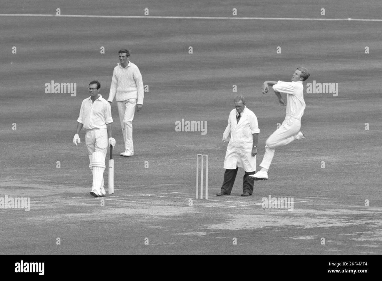 South African born Tony Greig bowling for Sussex Stock Photo - Alamy