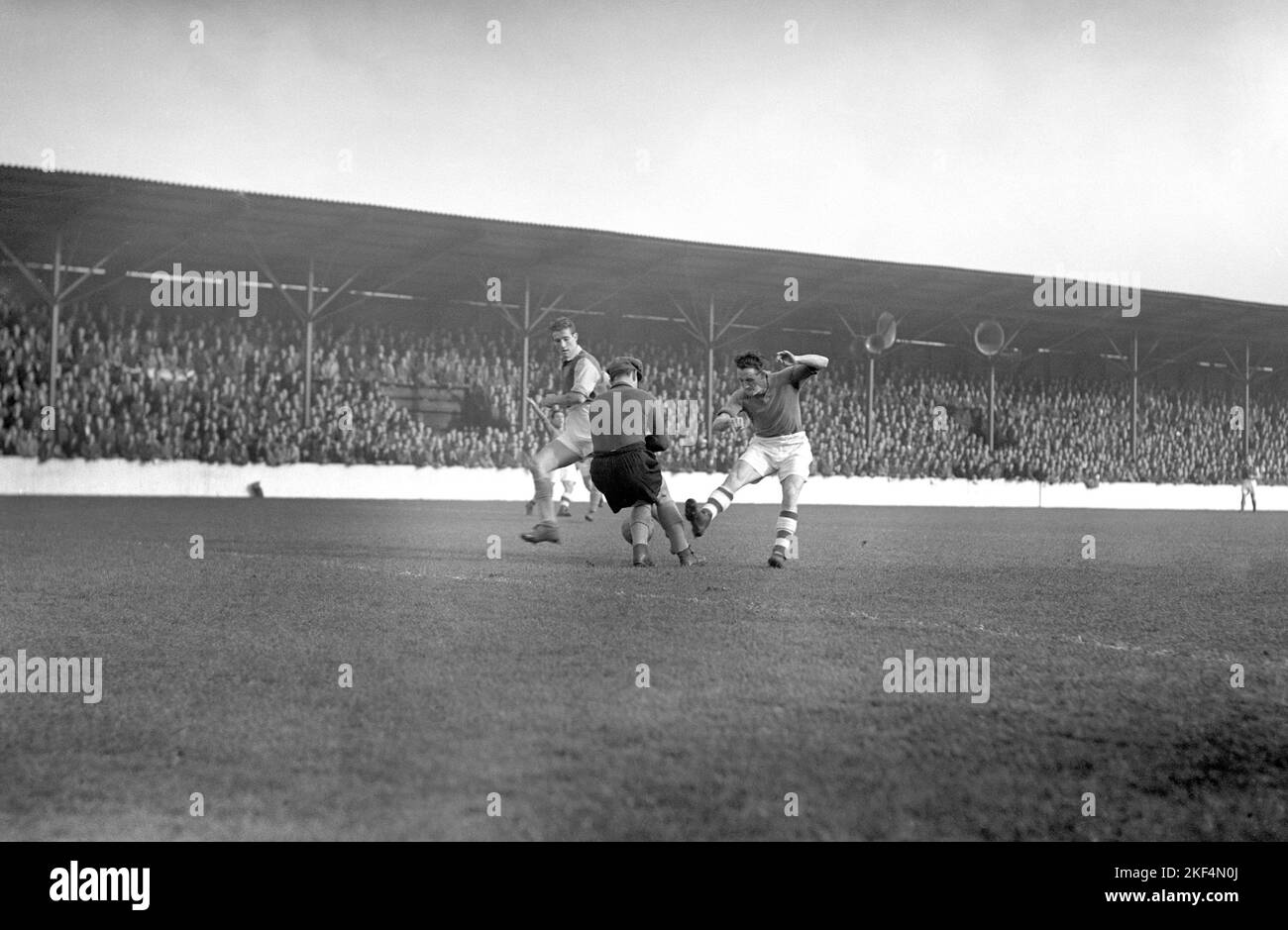 West Ham United goalkeeper Ernie Gregory comes out to save from ...