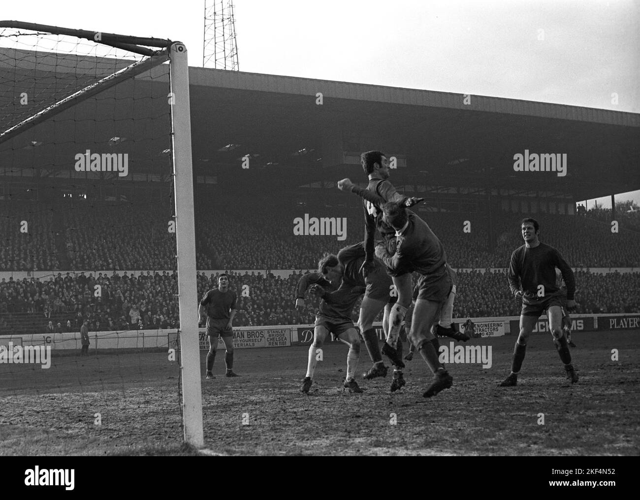 Peter Osgood (Chelsea) jumps high for the ball after a corner kick ...