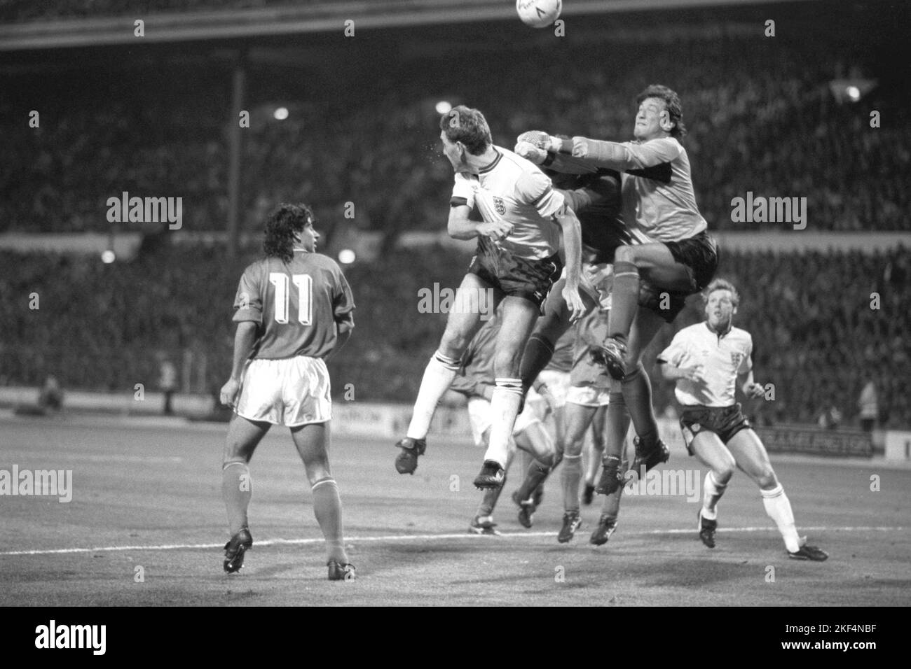Italian goalkeeper Walter Zenga punches clear of England's Terry ...