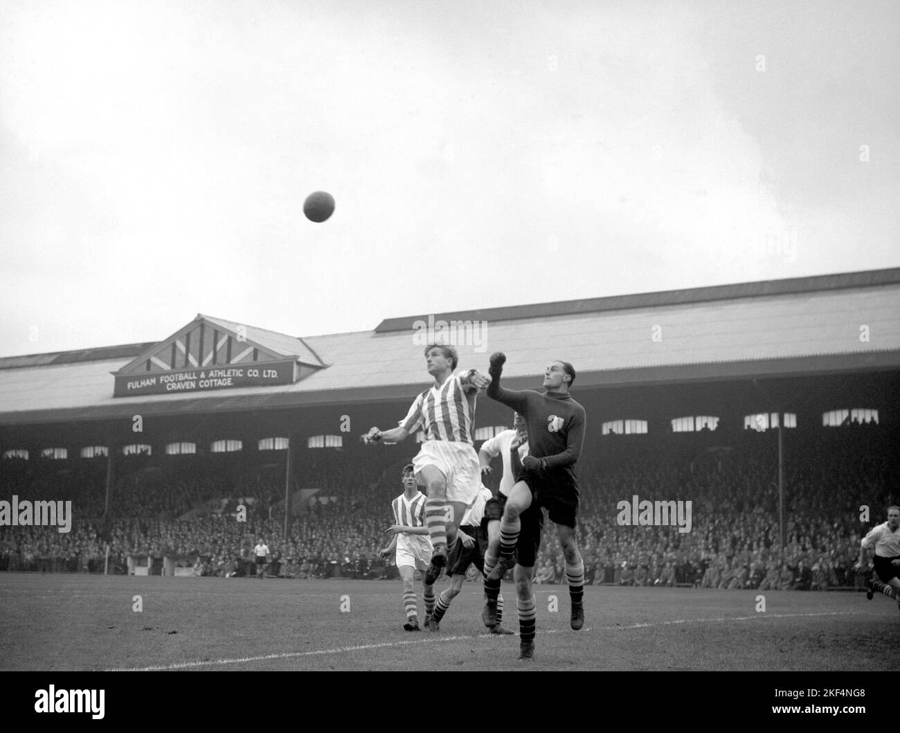 Huddersfield Town's Dave Hickson challenges Fulham goalkeeper Ian Black ...