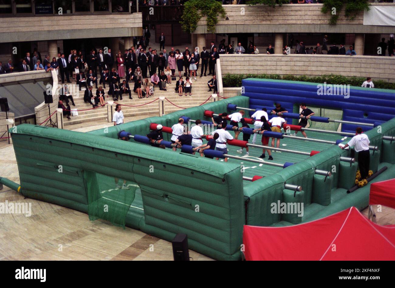People taking part in a giant human table football tournament in London ...
