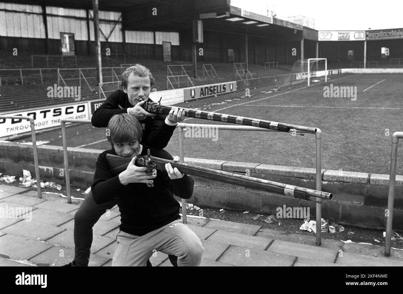 Walsall's hot shot striker Alan Buckley behind Alan Evans as they fire ...