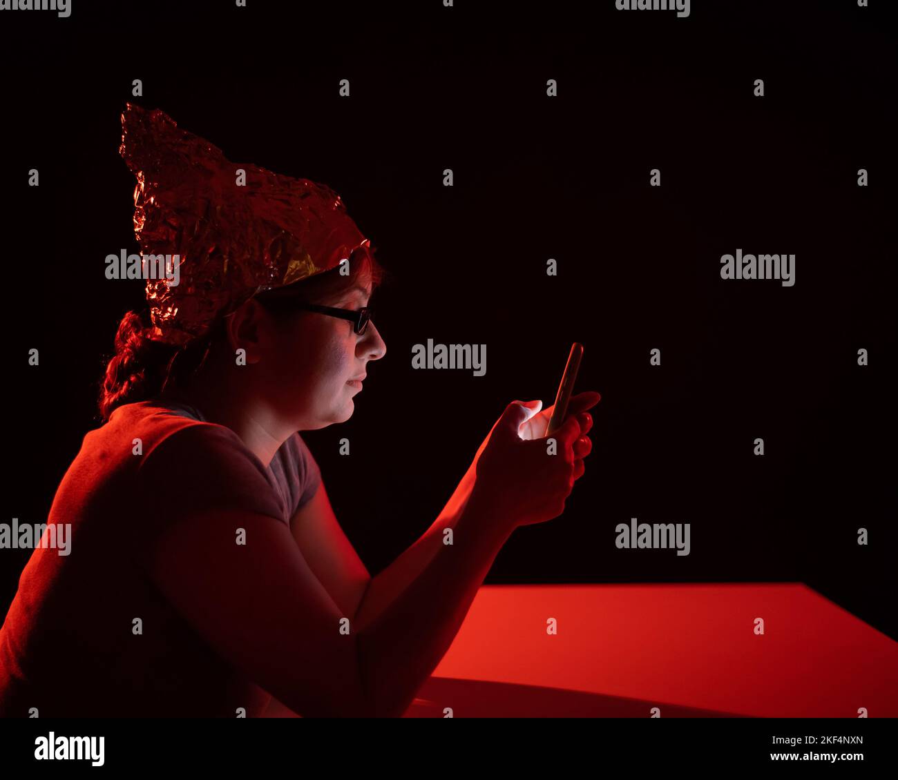 Paranoid caucasian woman using smartphone hi-res stock photography and ...