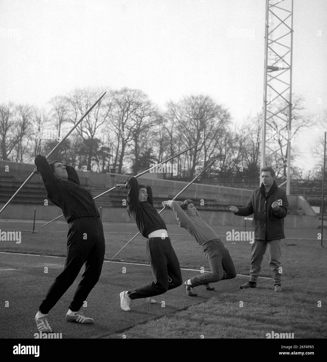 Coach Colin Smith puts Javelin throwers (Left to Right) Peter Nunn ...