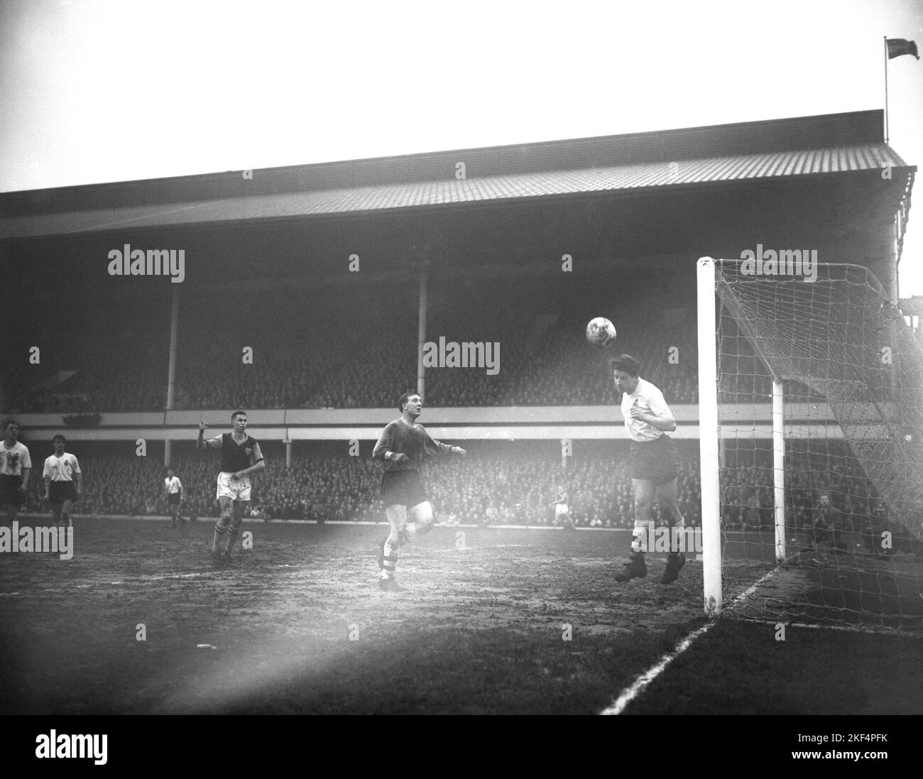 Roy Hartle the Bolton right back heads off the goal line, with Eddie ...