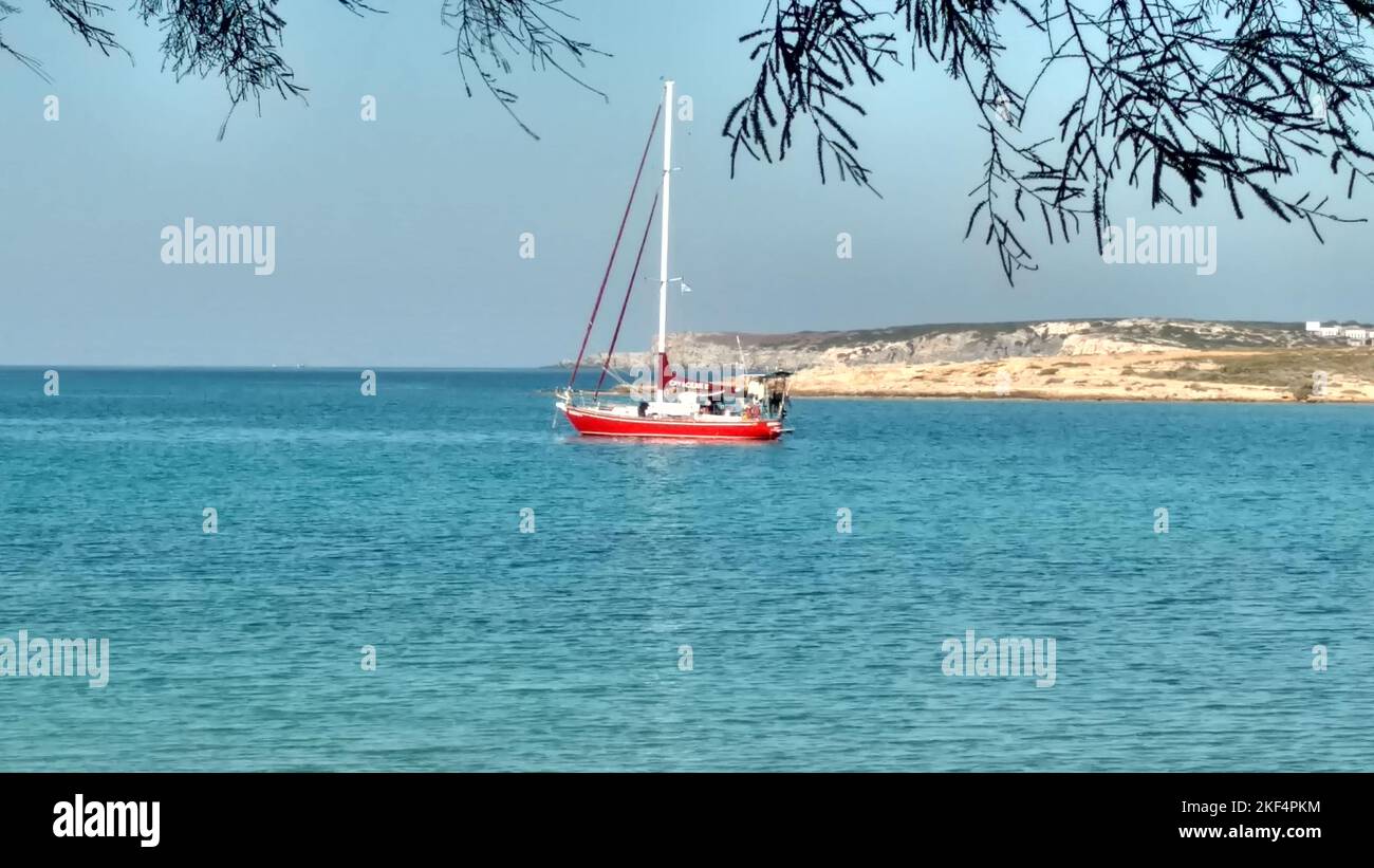 Red Sailing Boat in Lagoon Paros Greece mediteranean island aegean ...