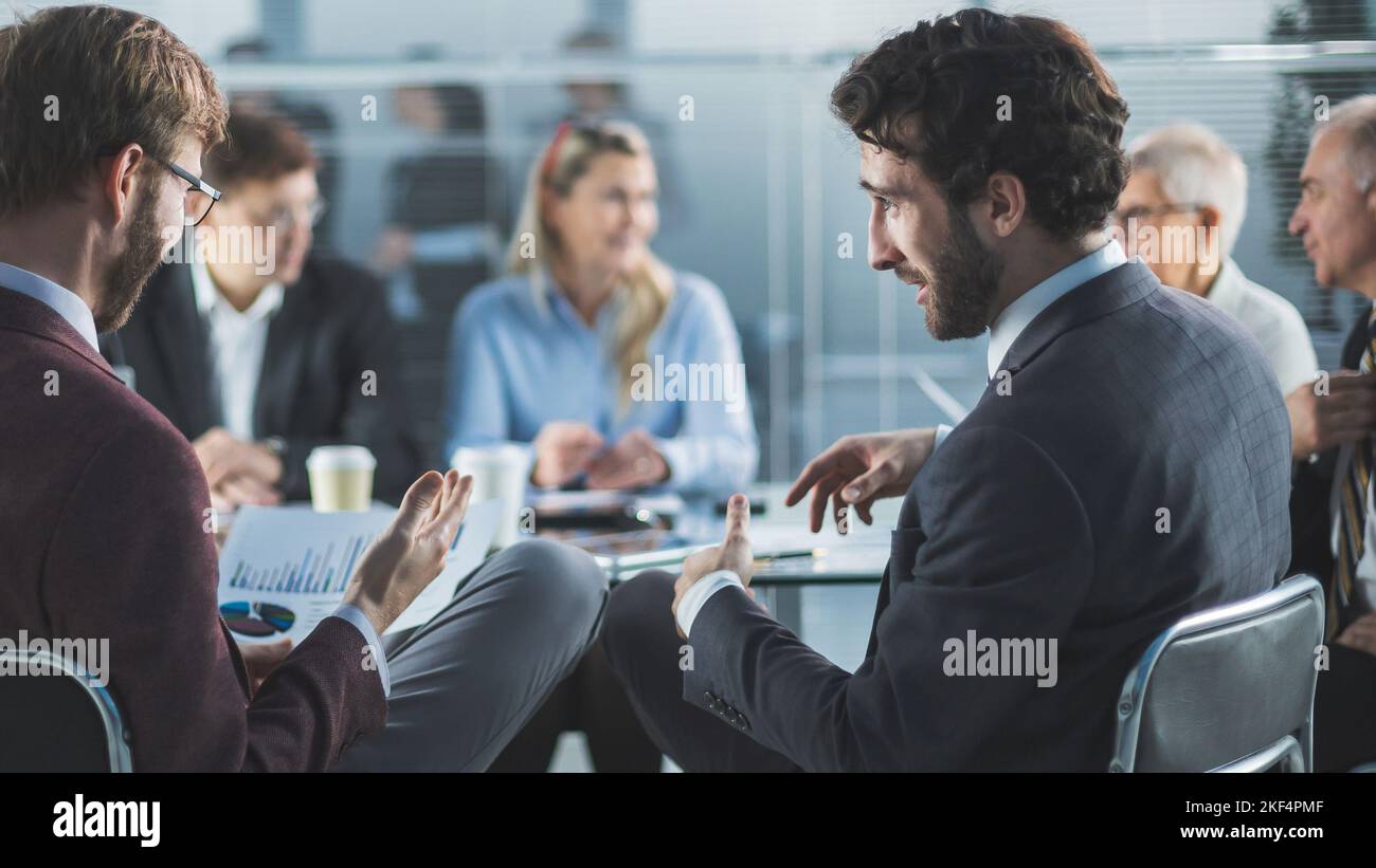rear view. business colleagues discussing the financial schedule Stock ...
