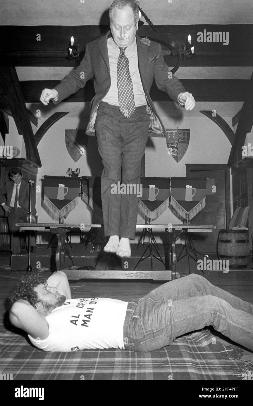 British strongman Allan Crossley having his stomach jumped on Stock ...