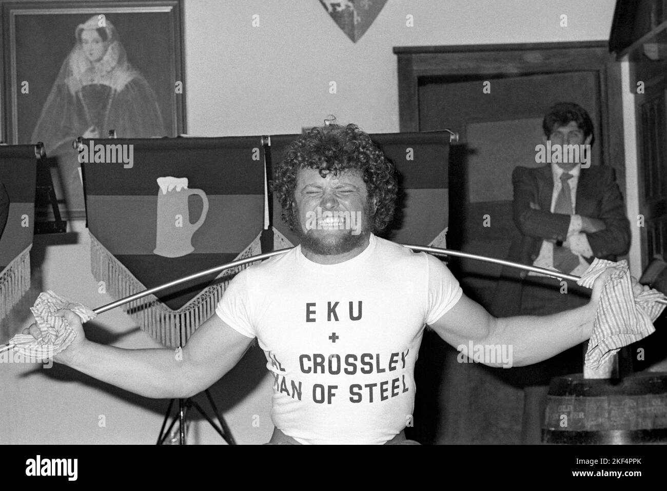 British strongman Allan Crossley bending a steel bar Stock Photo - Alamy
