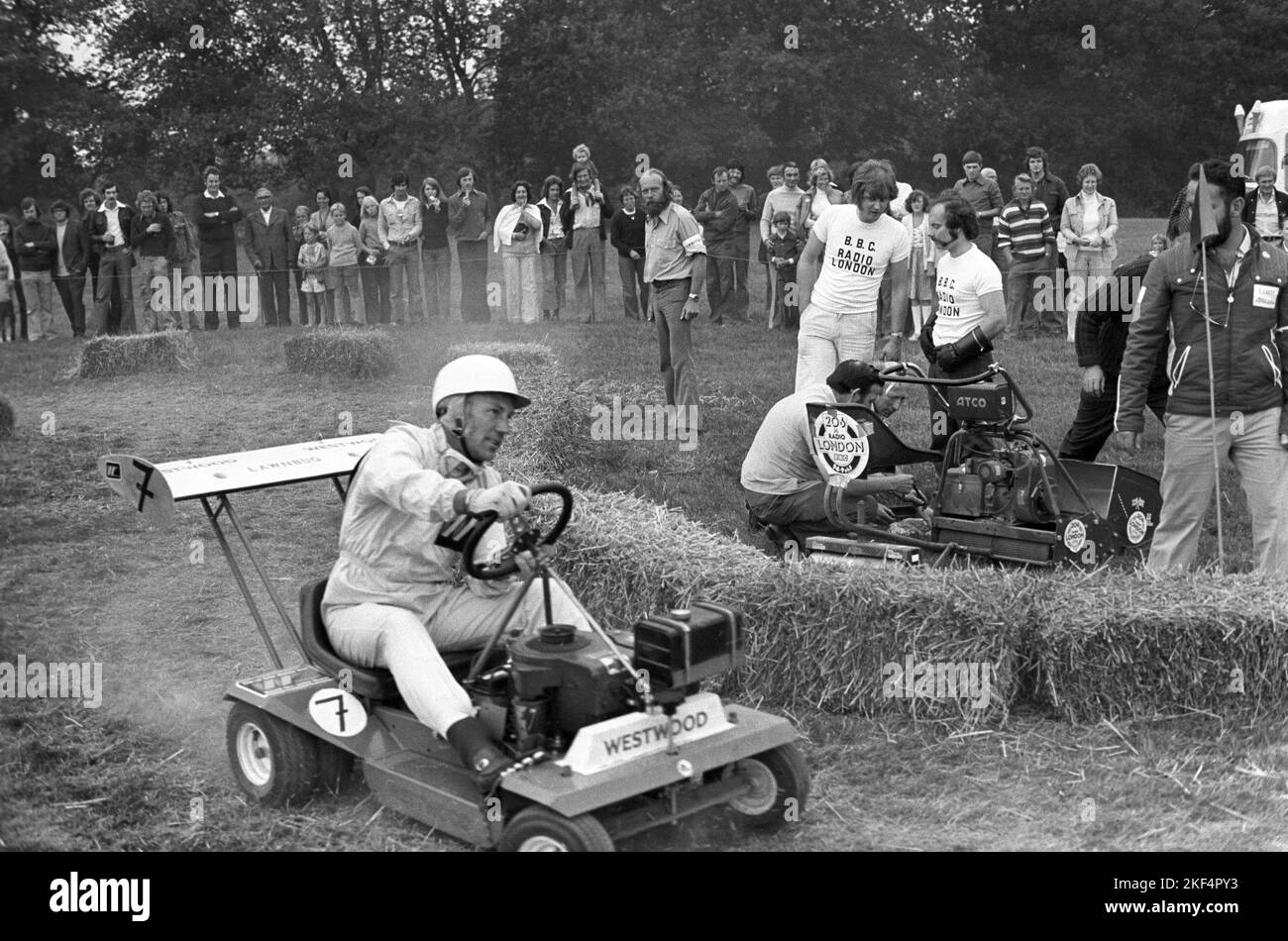 British Racing driver Stirling Moss in action at a Lawn Mower racing ...