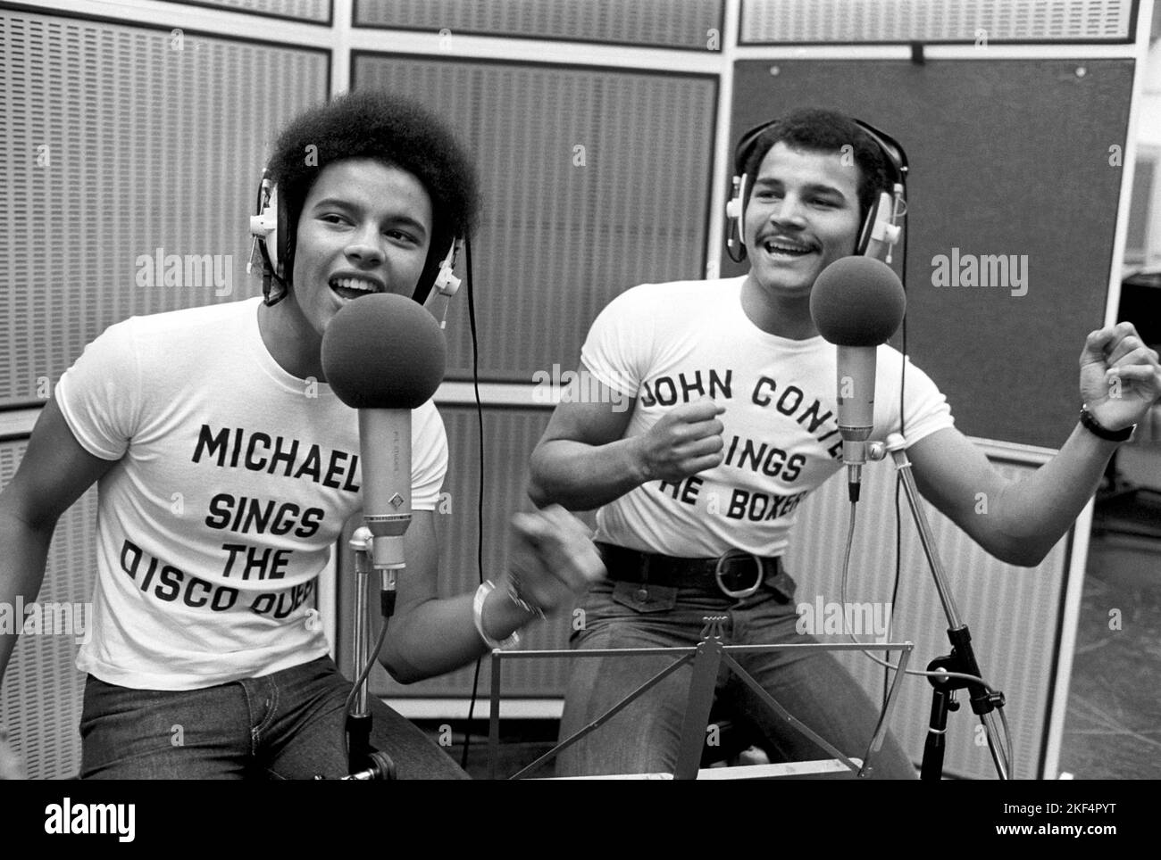 British boxer John Conteh (r) at the mike with brother Michael as they ...