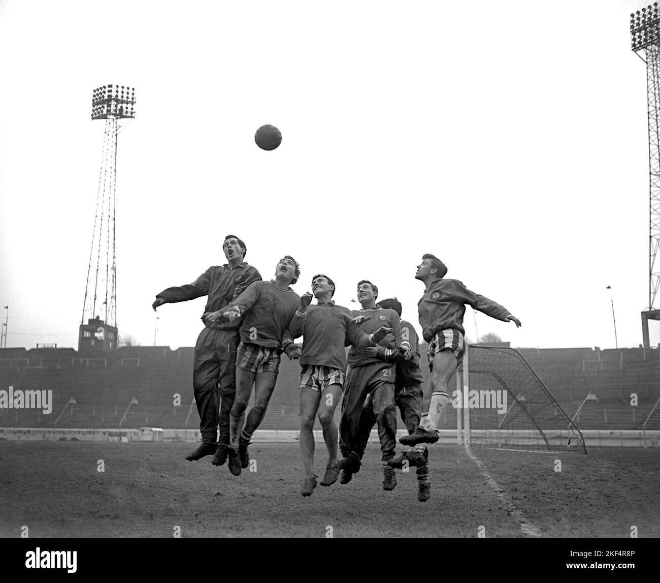 Chelsea players all jumping up for a header during training at Stamford ...