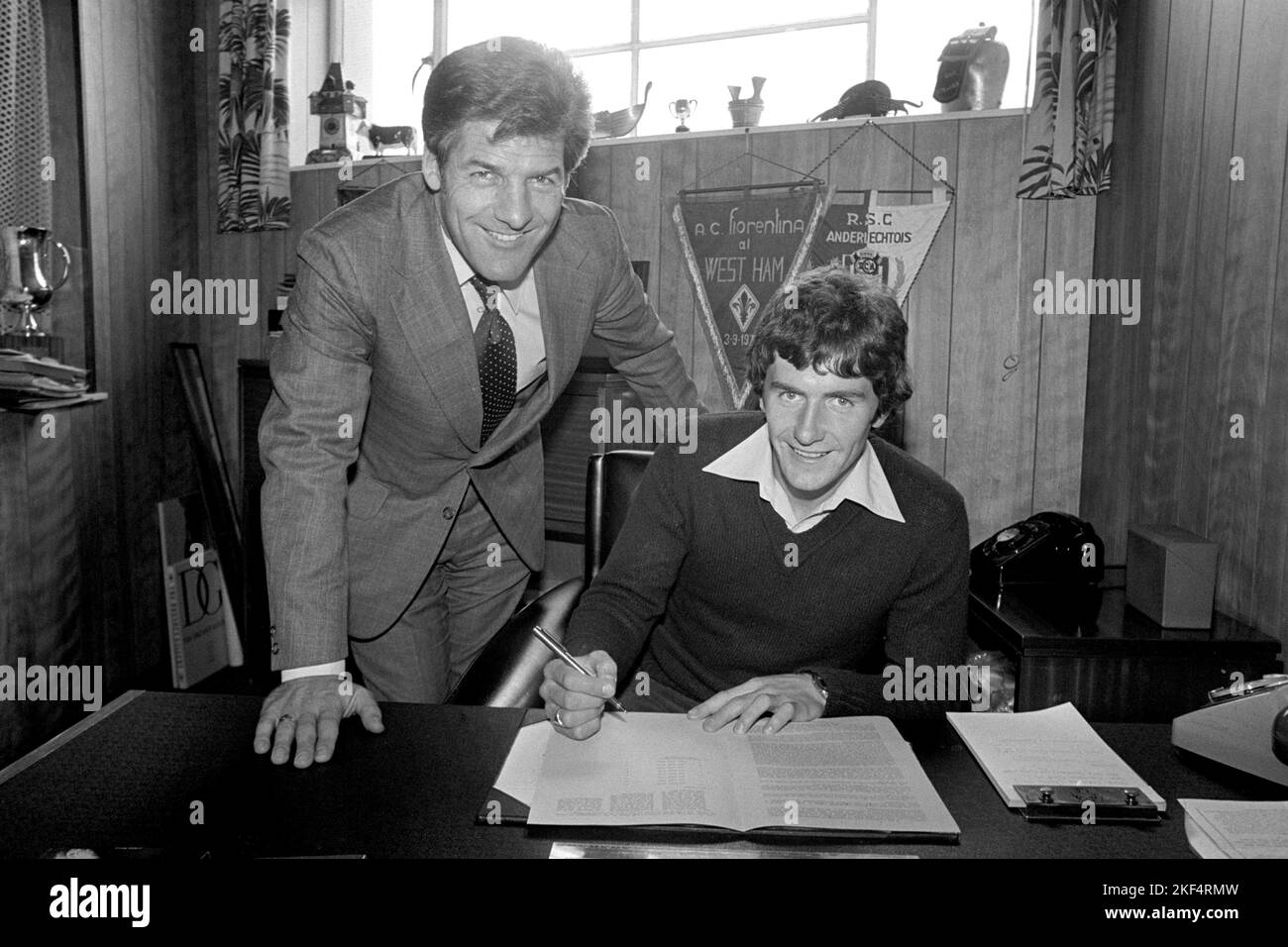 West Ham United manager John Lyall (l) looks on as Ray Stewart (r ...