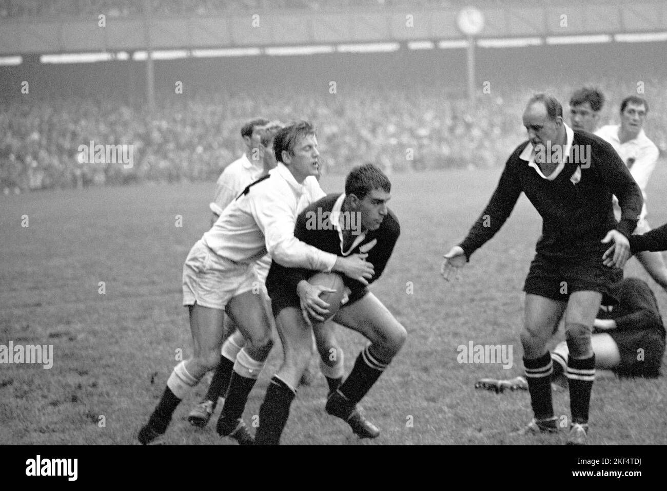 England's Keith Savage (l) tackles New Zealand's Colin Meads (c Stock ...