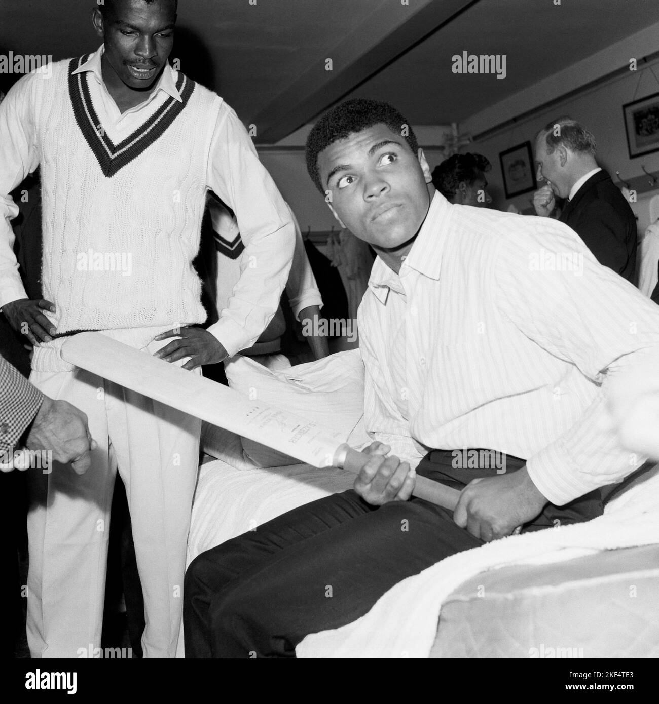 World Heavyweight Boxing Champion Muhammad Ali tries using a baseball ...