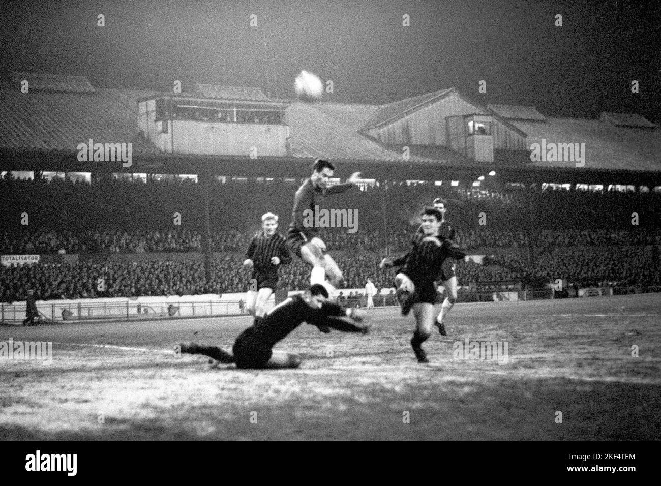 AC Milan's Santin (r) hacks the ball away as goalkeeper Balzarini (l ...