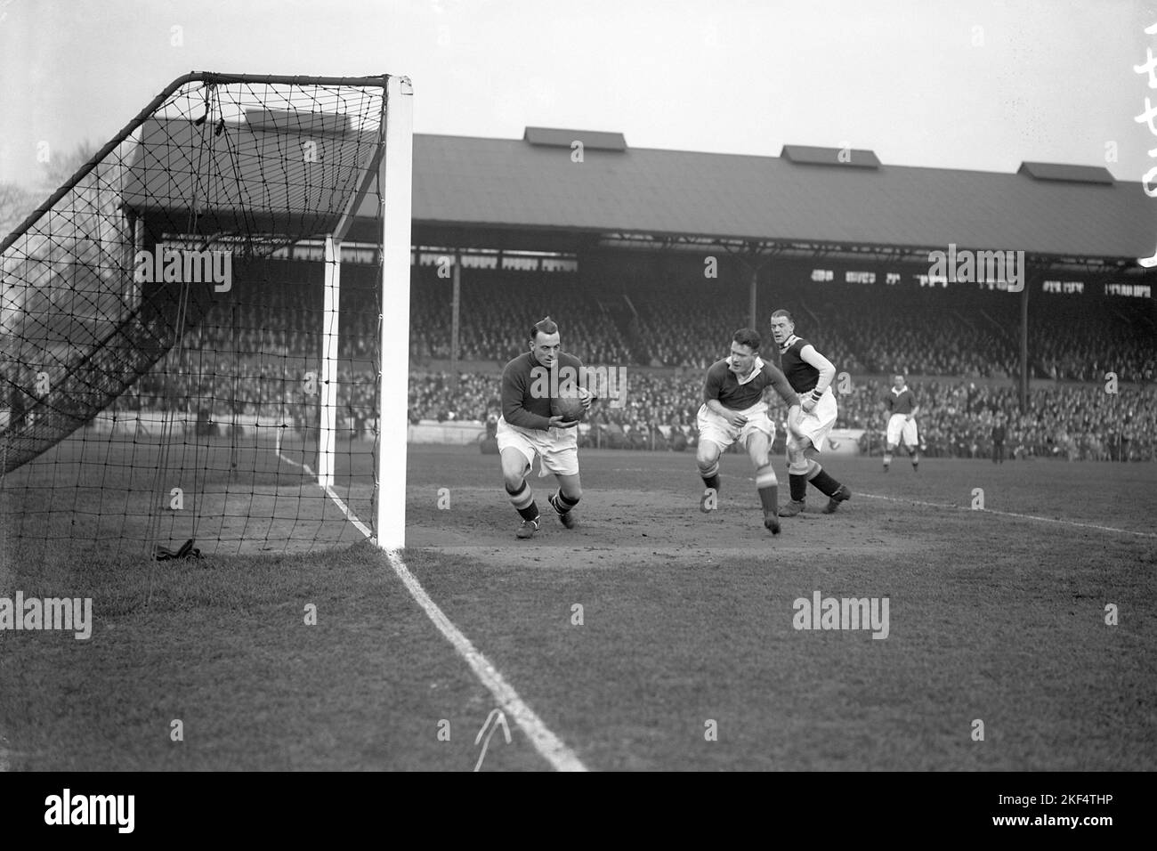 Aston Villa goalkeeper Fred Biddlestone (l) saves as Chelsea's Jimmy ...