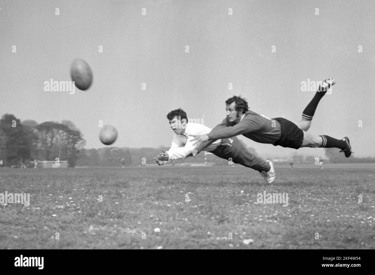 Gareth Edwards and Ray Hopkins fly through the air as the British Lions ...