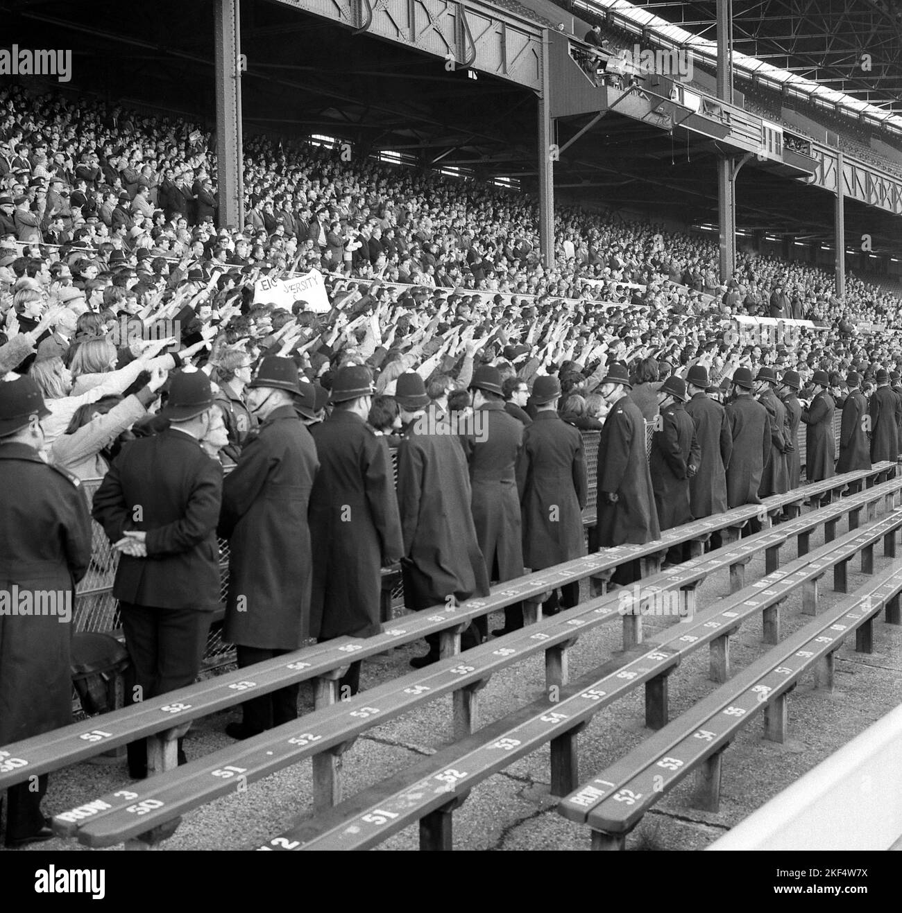 A line of policemen next to the crowd in case of demonstrations by ... A line of policemen next to the crowd in case of demonstrations by ...