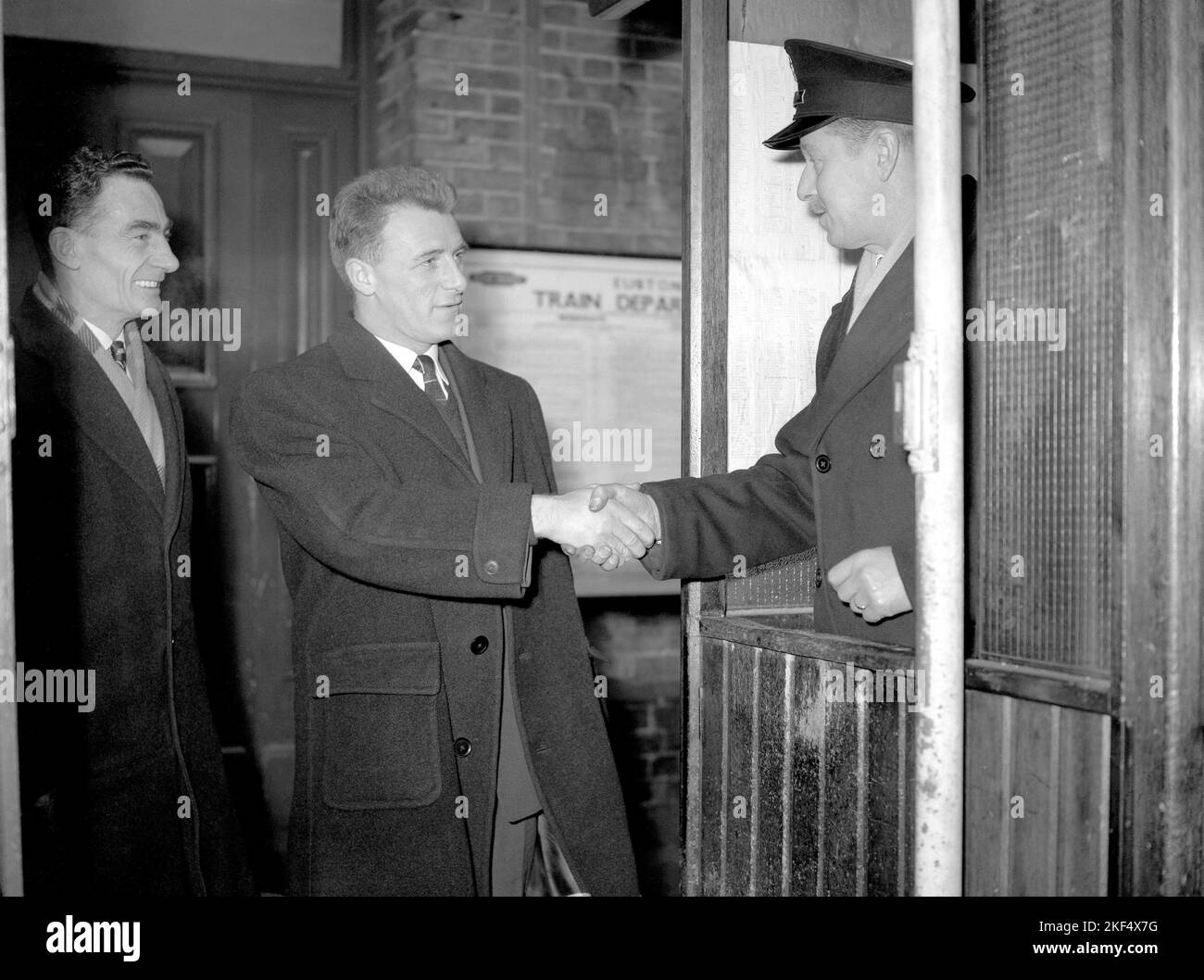 Euston station ticket collector AJ Duffield (r) congratulates new ...